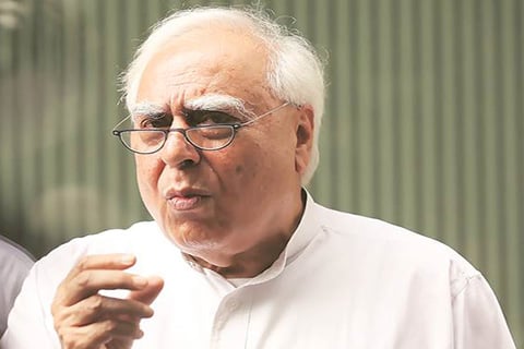 Azad hails Kapil Sibal for defending Article 370